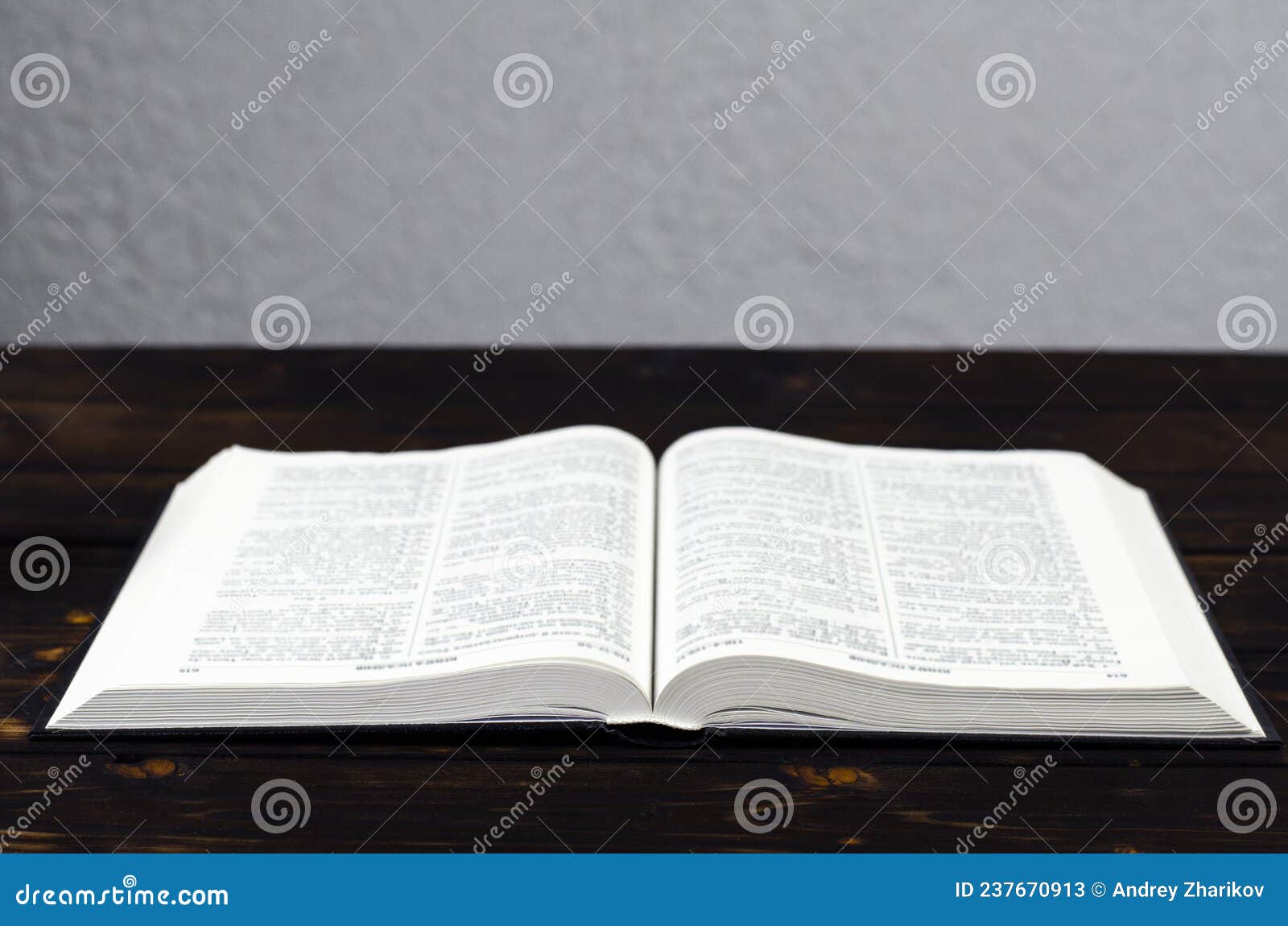Open Bible, on a Wooden Table. Light from the Book. Desktop. Stock ...