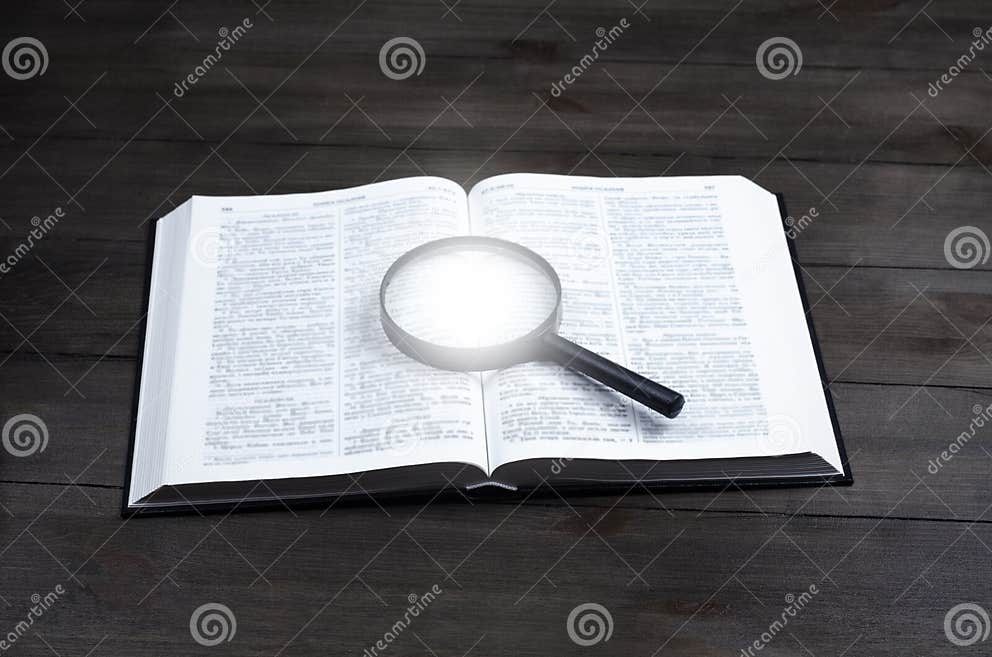 Open Bible. on the Table. Holy Bible, Scripture. Magnifier Stock Image ...