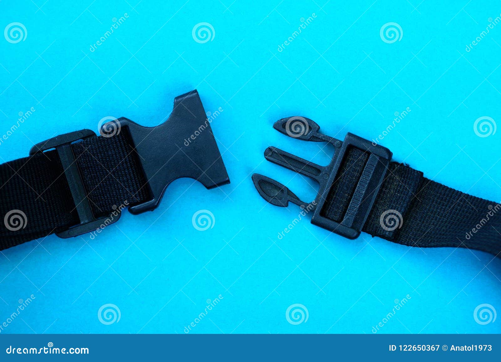 Open Black Plastic Carabiner on Harnesses on a Blue Background Stock ...