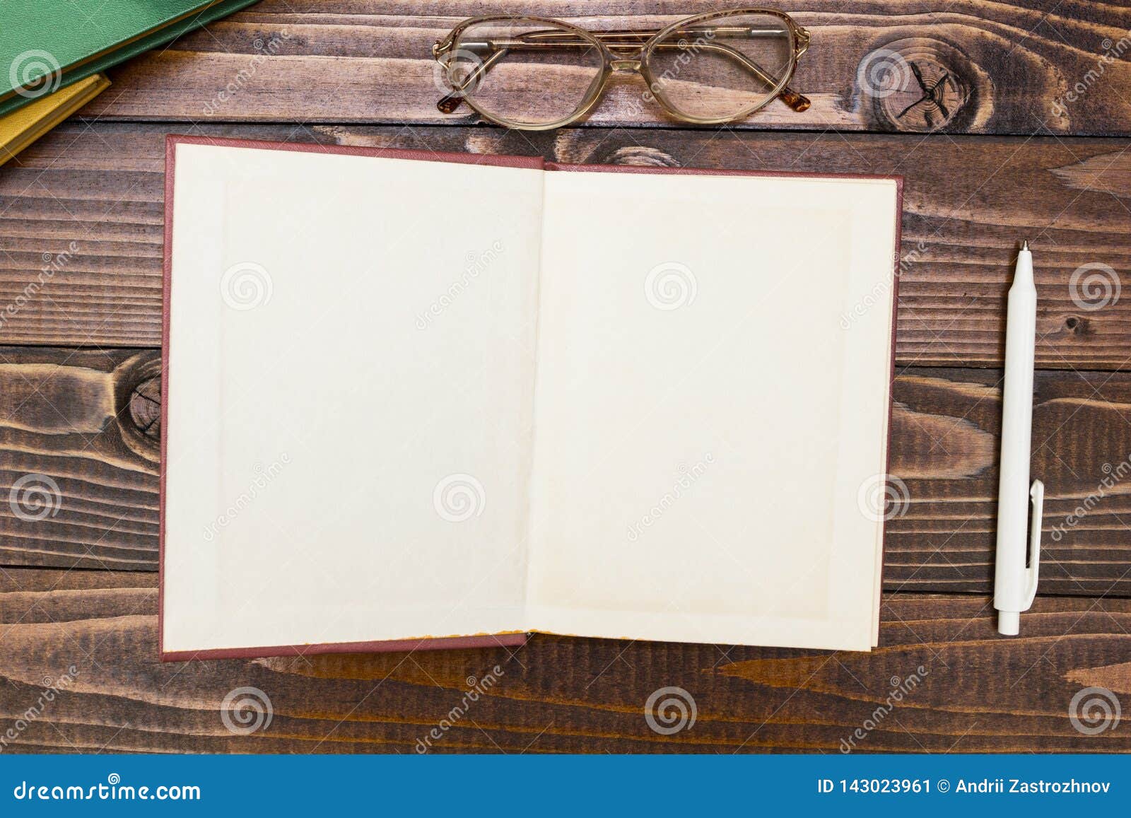 Open Blank Book, Pen and Glasses on a Wooden Table. View from Above ...