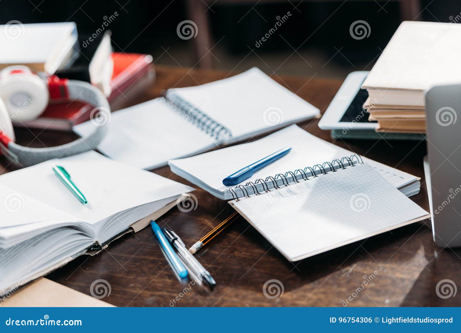Open Blank Notebooks with Pens and Books on Wooden Table Stock Photo ...