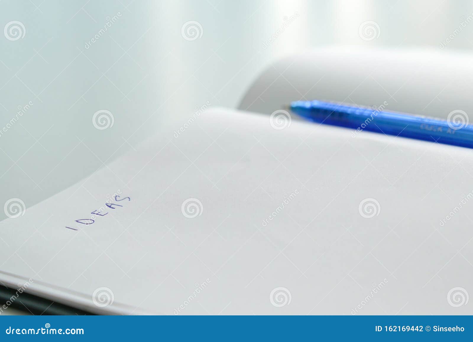 Open Blank Notepad with Pen and the Word Ideas Written on it Stock ...
