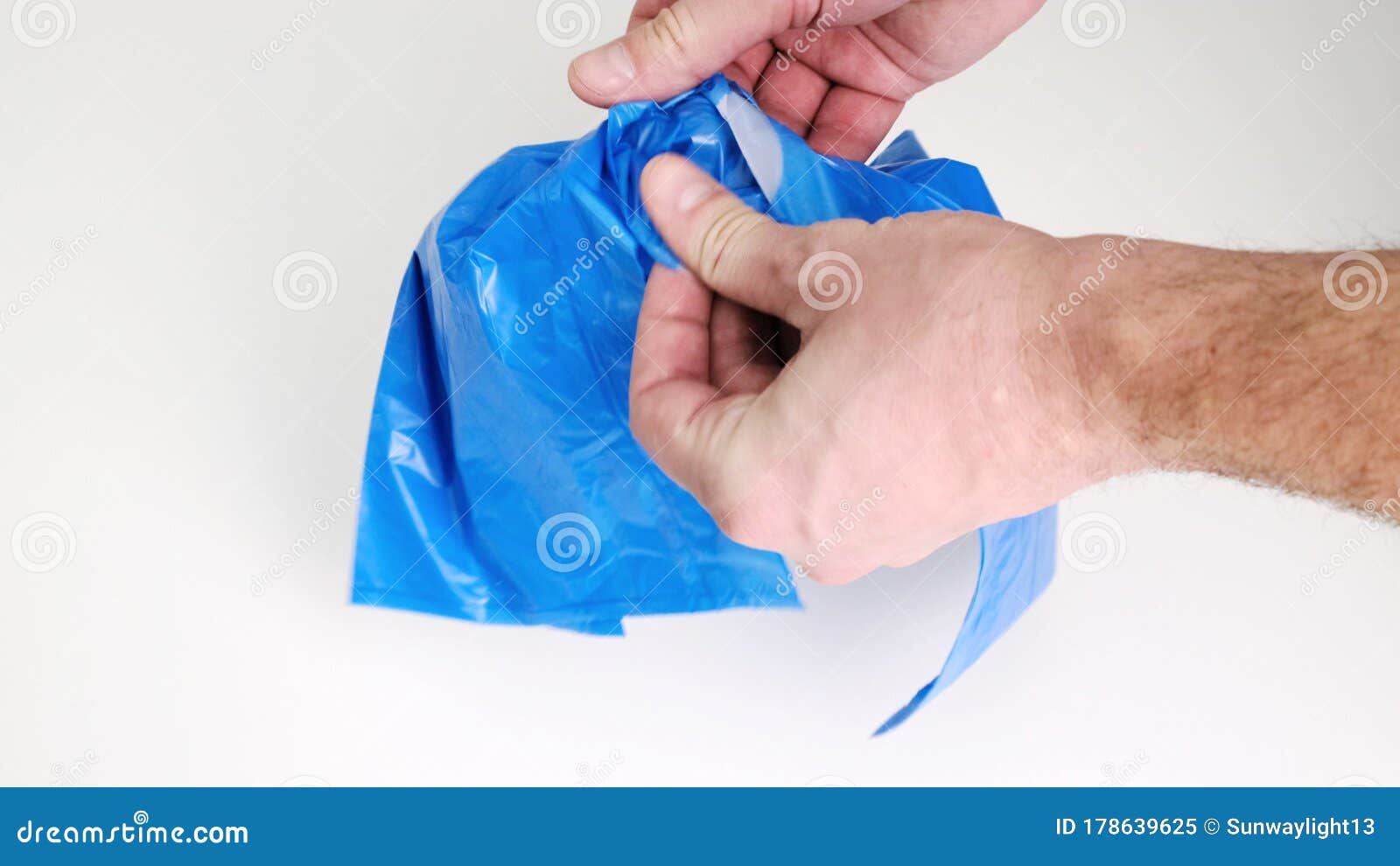 Open Blue Trash Bag on Kitchen on White Background. Close Up. Stock ...
