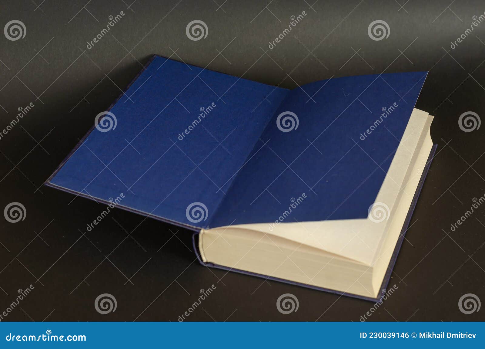 Open Book on a Black Background. Textbook with Blue Endpapers Stock ...