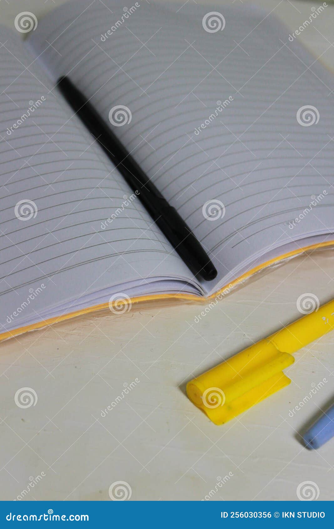 Open Book with Black Lines with Colorful Pencils on a White Table Stock ...