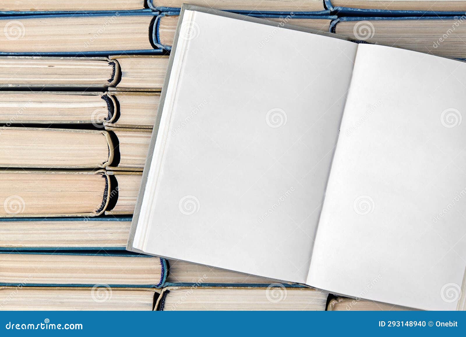 An Open Book With Blank Pages, A Diary On A Stack Of Shabby Books ...