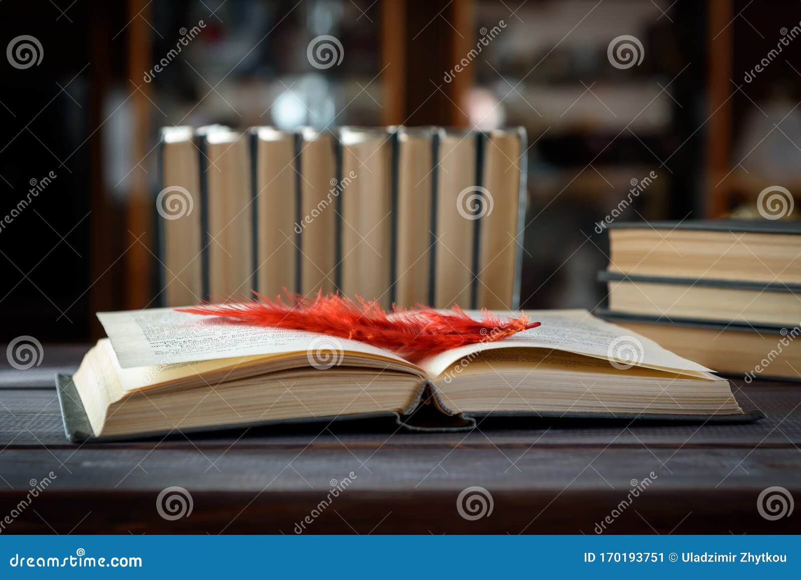 Open Book with a Bookmark on a Wooden Table. Stock Image - Image of ...