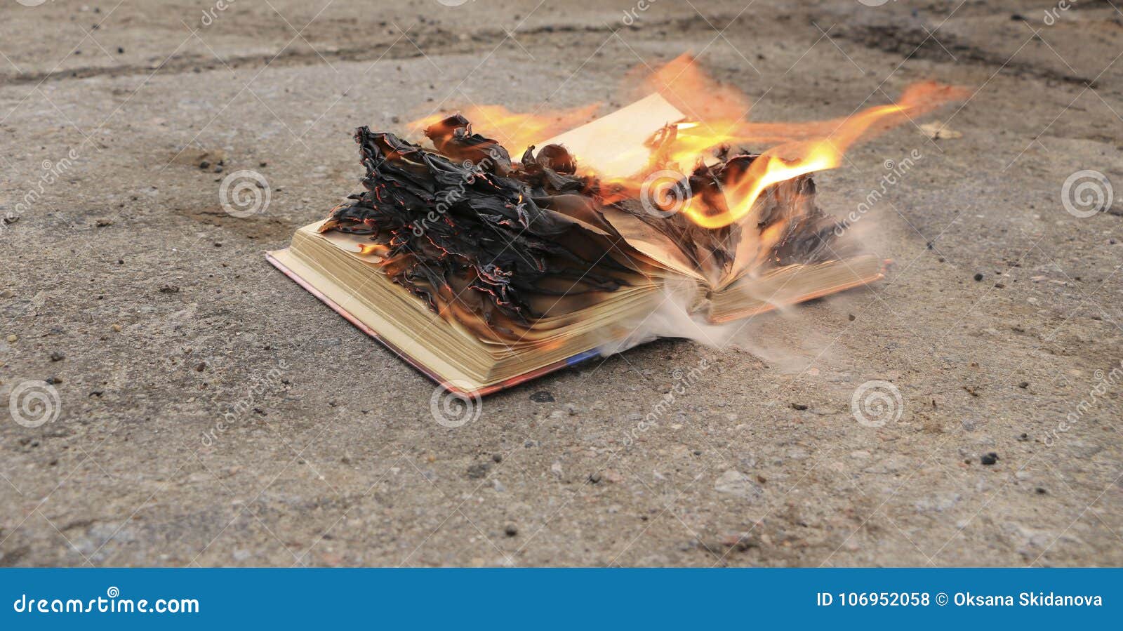 Book with Burning Pages on a Concrete Surface Stock Photo - Image of ...