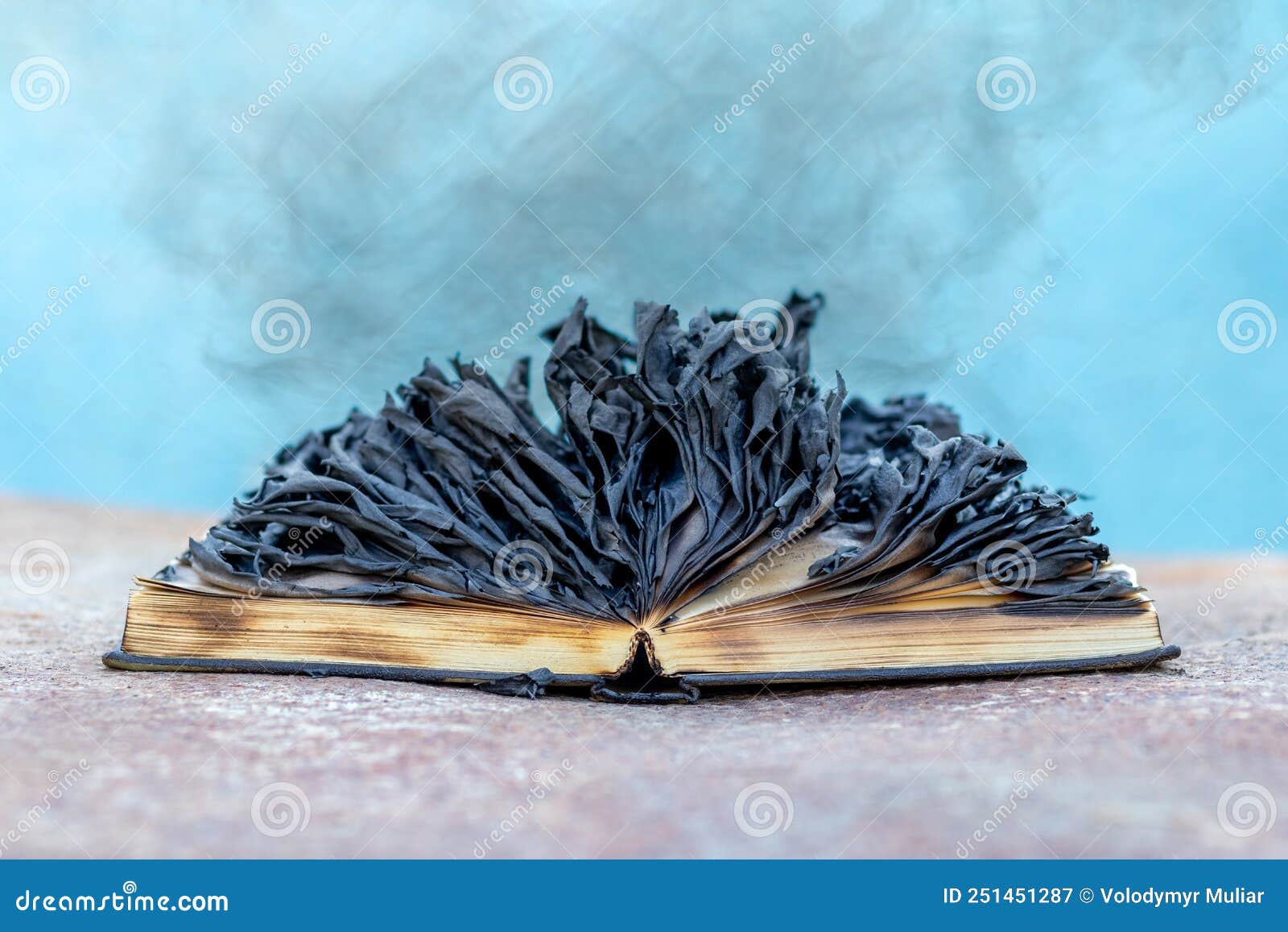 An Open Book with Burnt Charred Pages and Black Smoke Stock Image ...