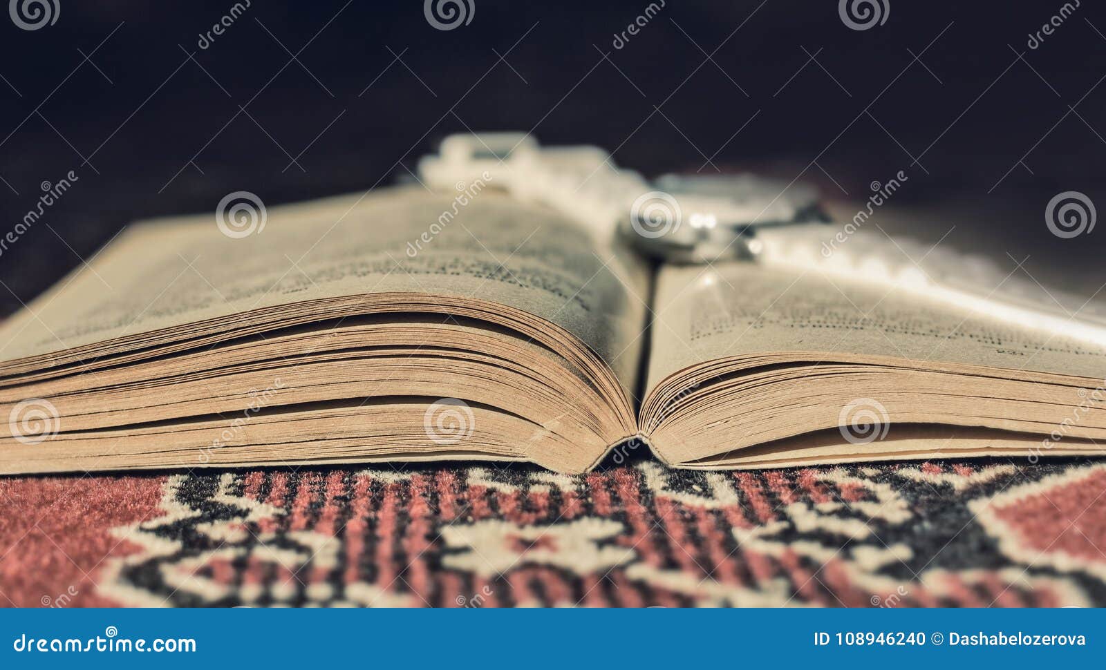 Open book and clock on it stock photo. Image of book - 108946240