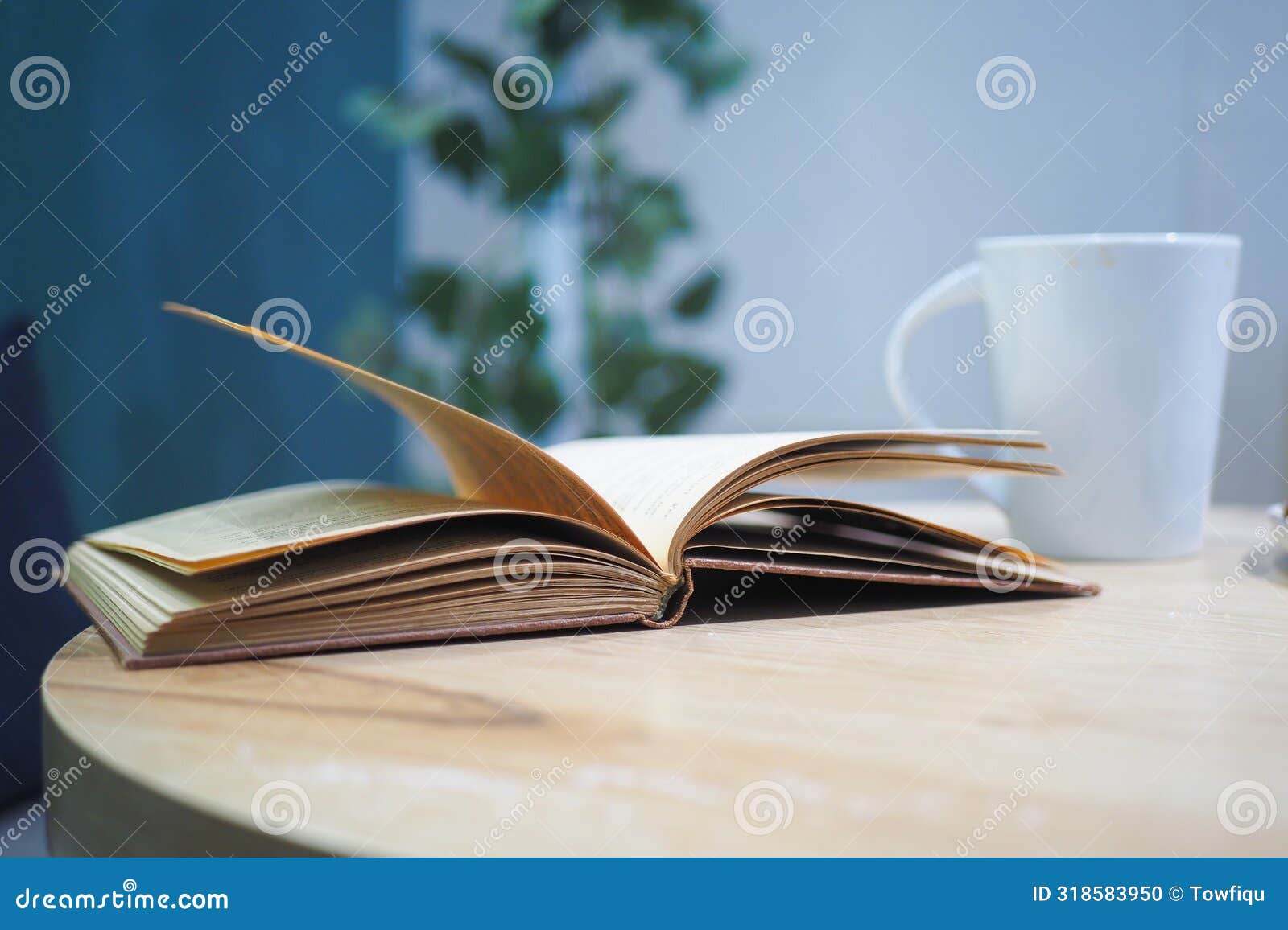 A Open Book and a Coffee Cup on a Cafe Table Stock Photo - Image of ...