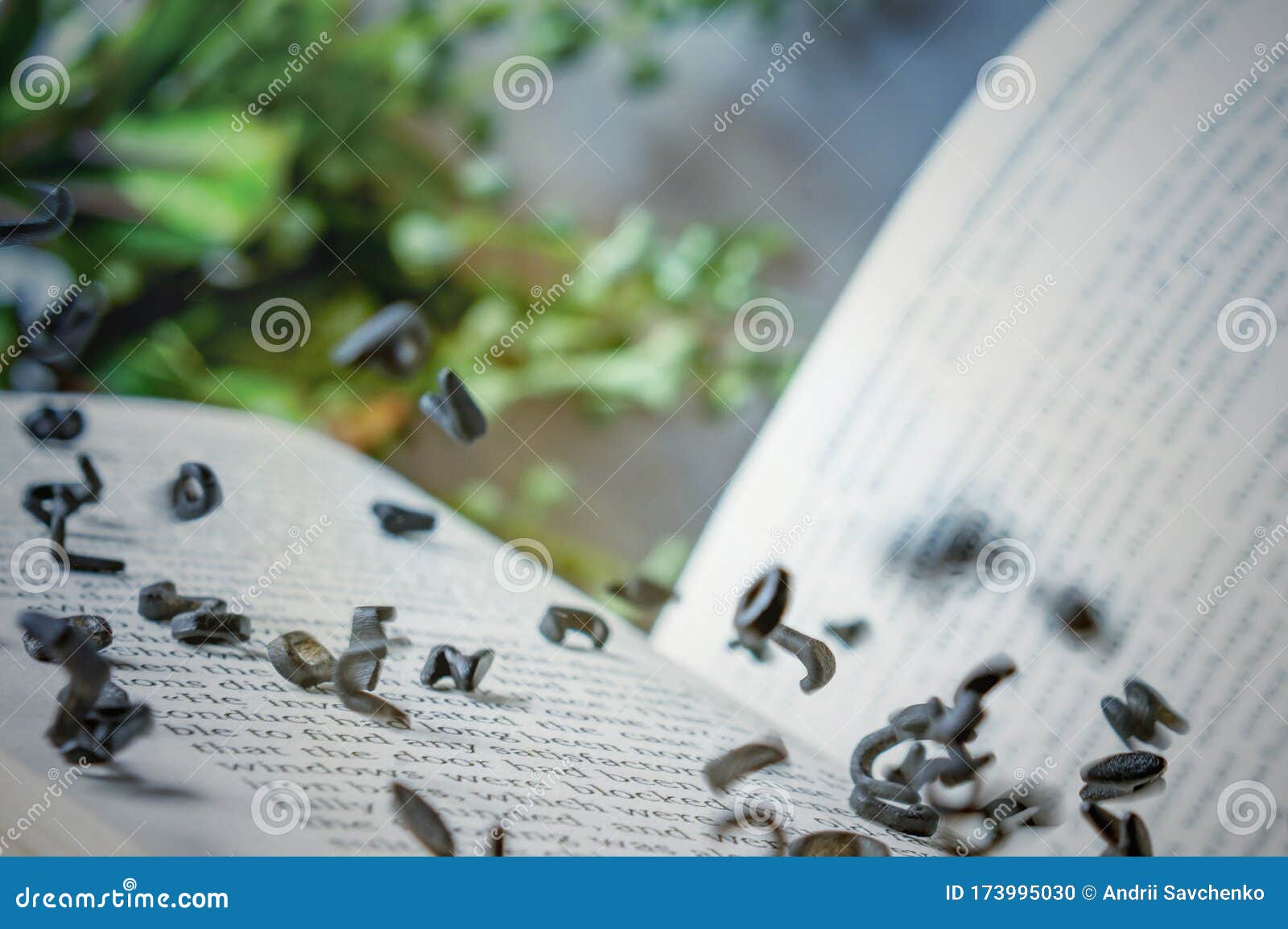 Open Book with Falling Black Letters Stock Photo - Image of dream ...
