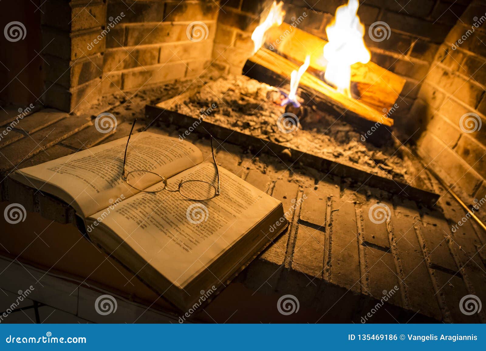 Open Book beside Burning Fireplace Stock Photo - Image of fireplace ...
