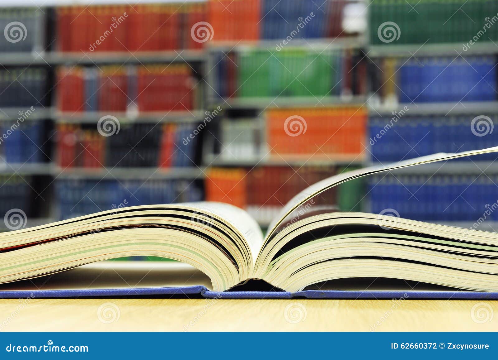 Open Book in Front of Bookshelf Stock Photo - Image of learning ...