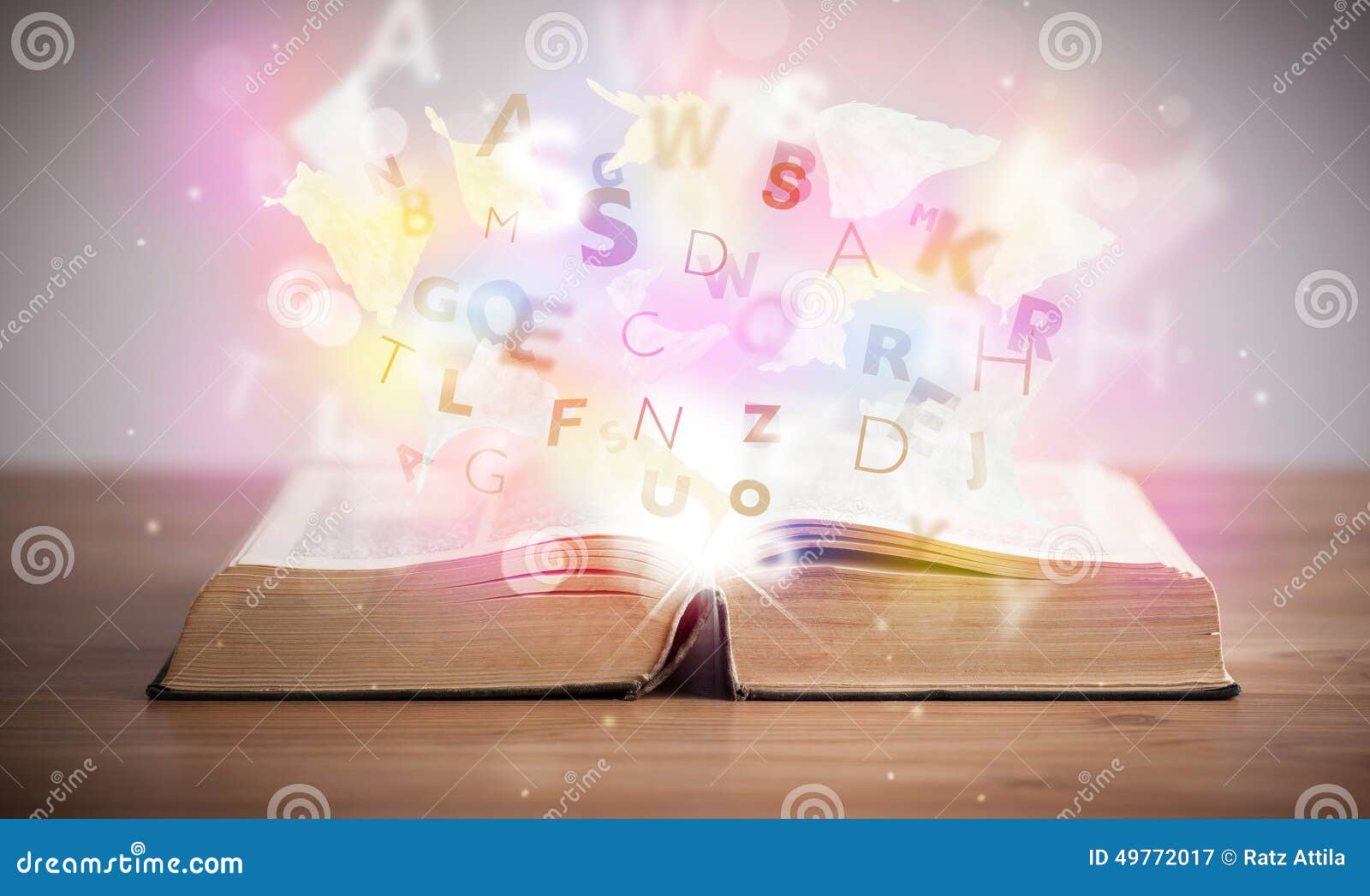 Open Book with Glowing Letters on Concrete Background Stock ...