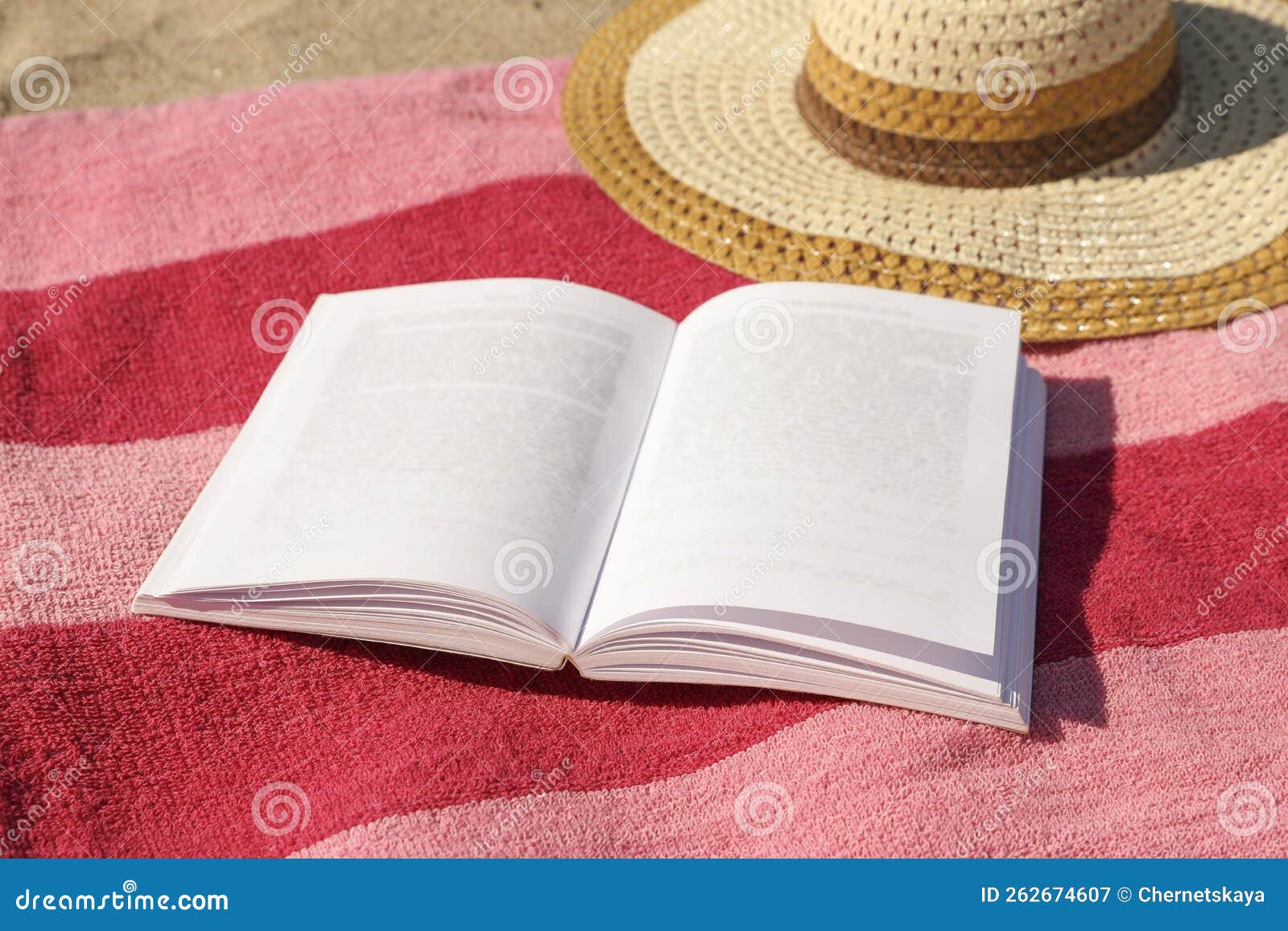 Open Book, Hat and Striped Towel on Sandy Beach Stock Image - Image of ...