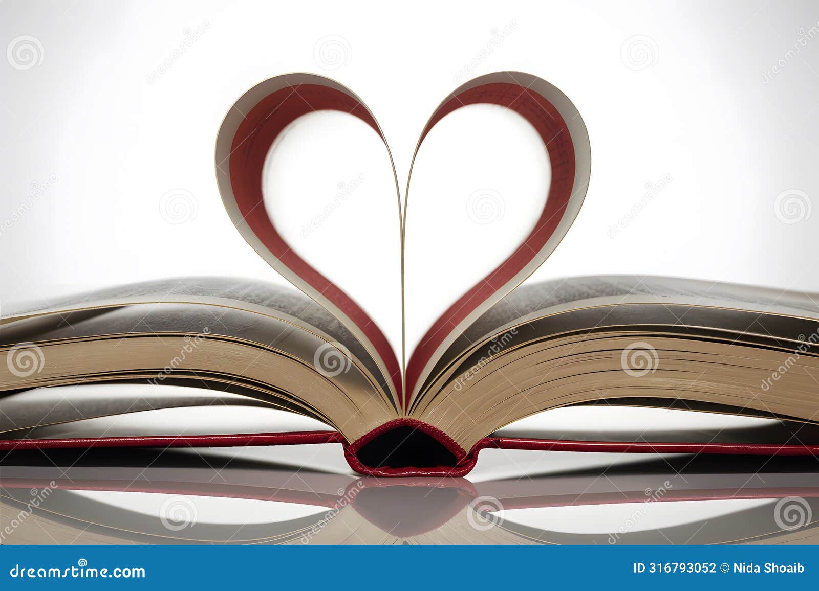 An Open Book with Heart Shape on White Background Reflects Soft Light ...
