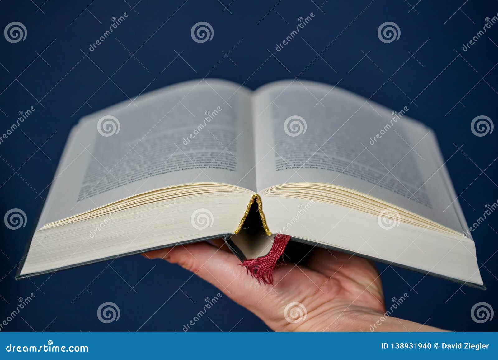 Open book in a hand stock photo. Image of object, read - 138931940