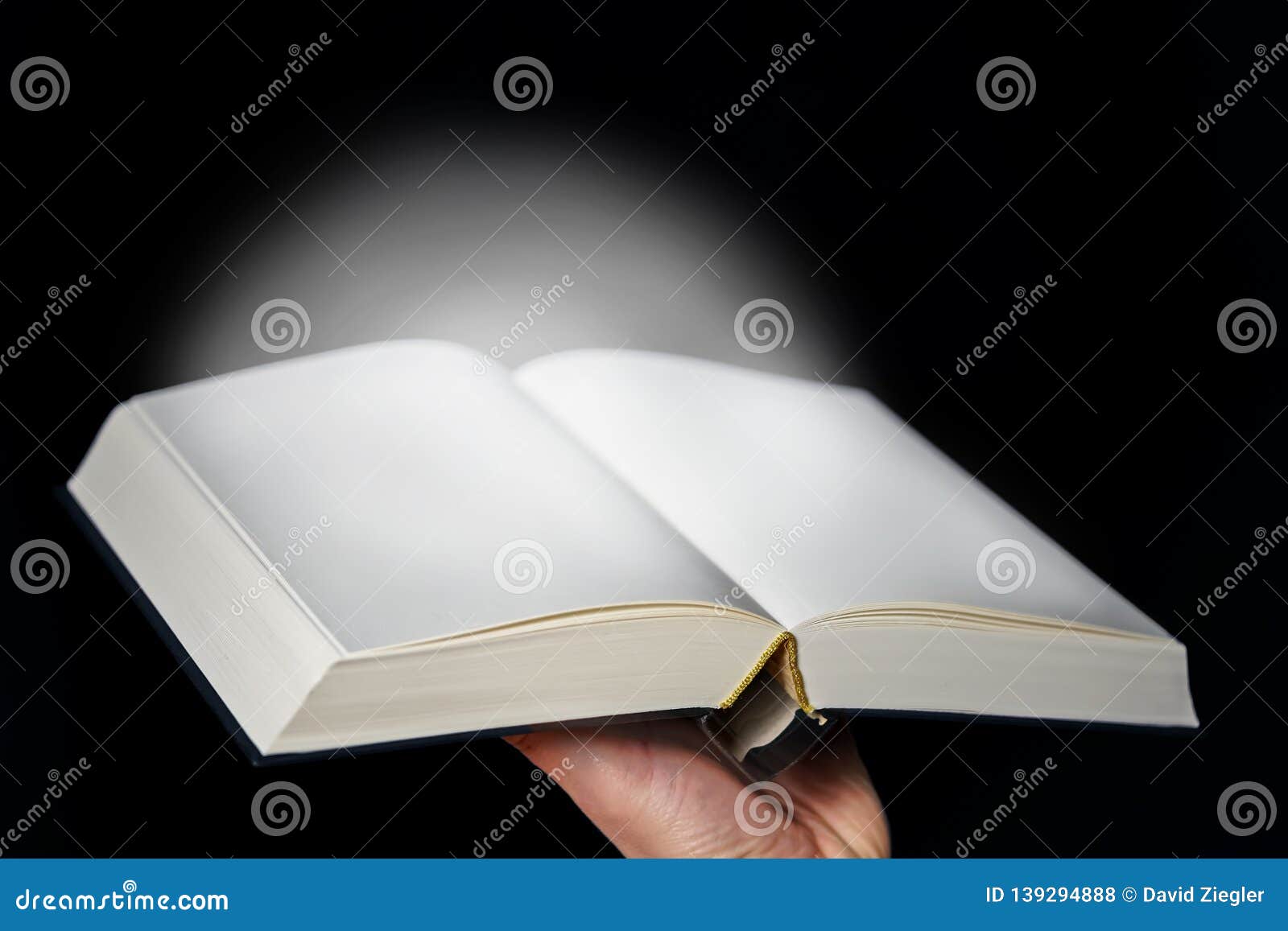 Open book held by a hand stock photo. Image of stack - 139294888