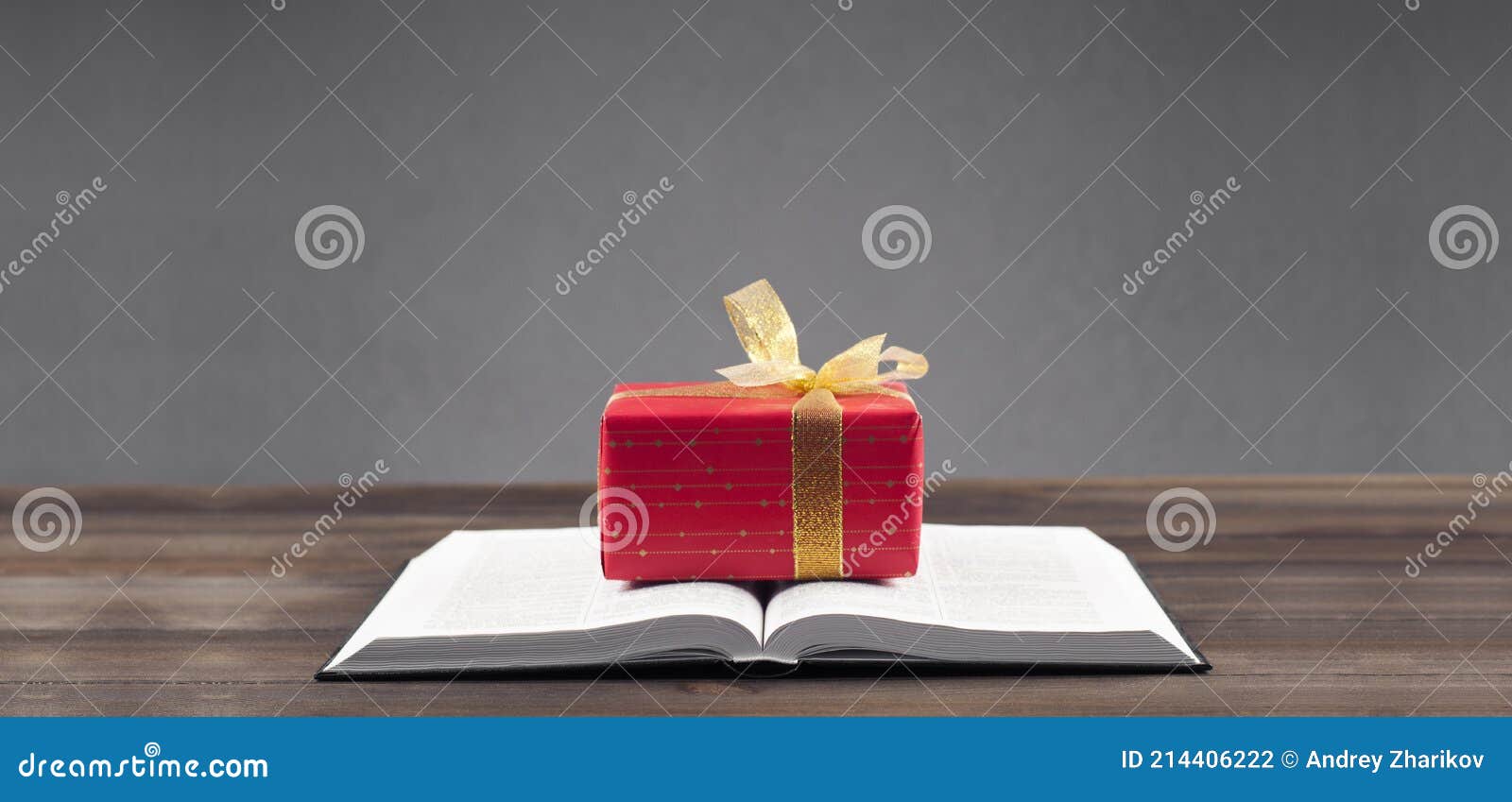 Open Book. Holy Bible. Scripture. Gift in Red Packaging and a Banot. on ...