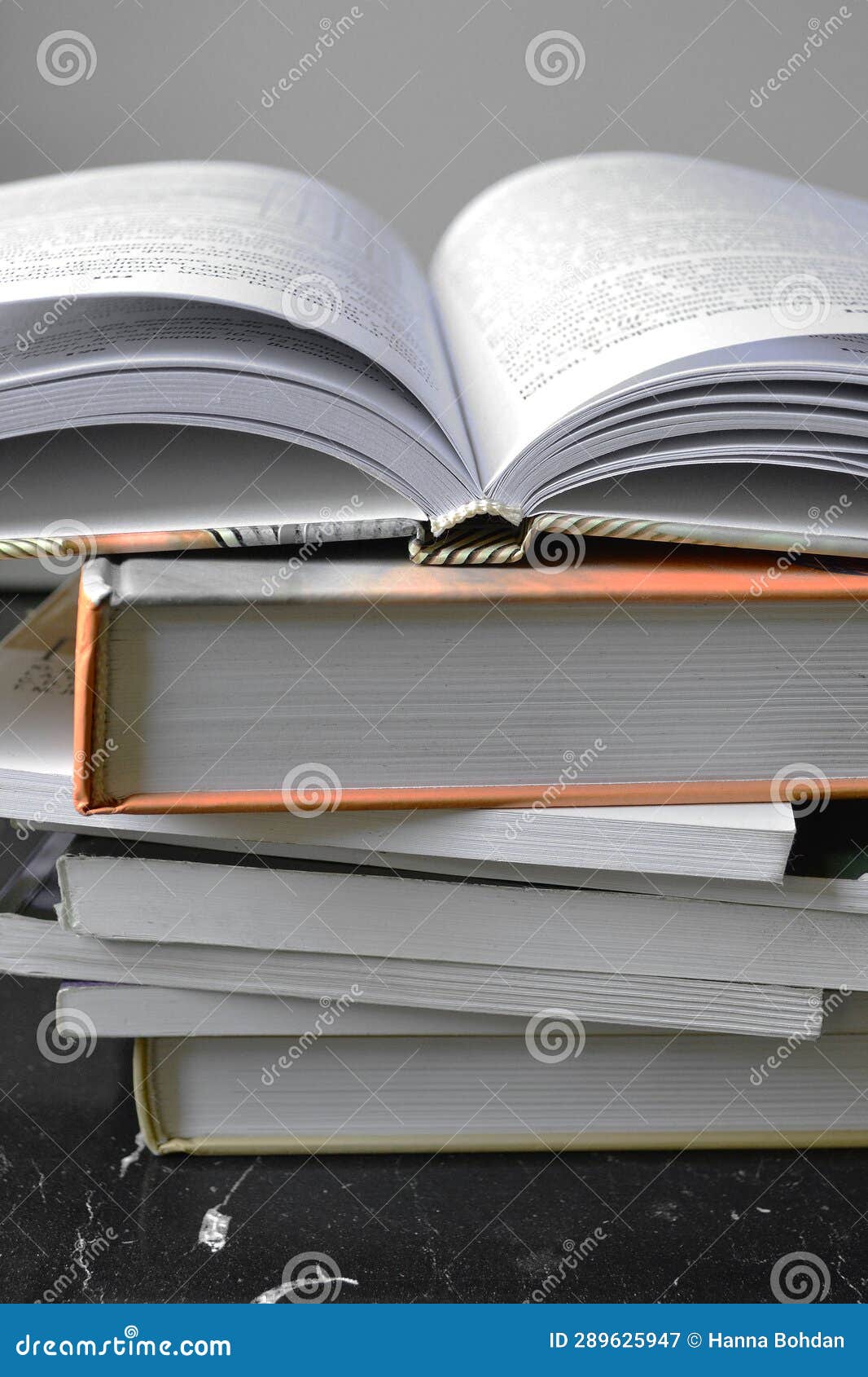 An Open Book Lies on a Stack of Books Stock Image - Image of textbook ...
