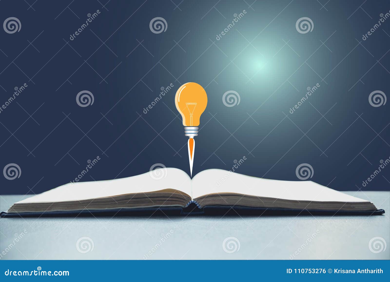 Open Book with Light Bulb Launch. Book Open on Desk Stock Photo - Image ...