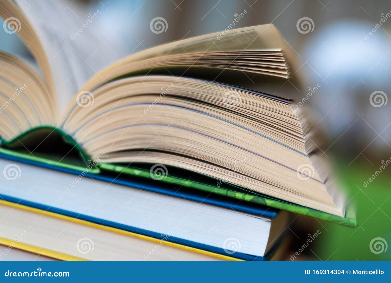 Open Book Lying on the Table in the Library Stock Photo - Image of ...