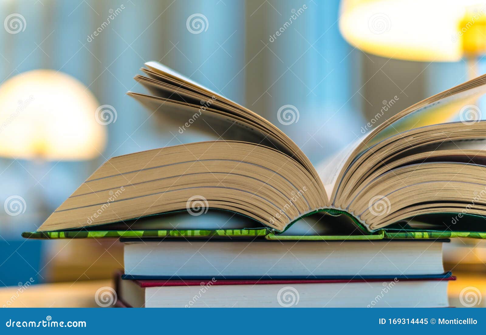 Open Book Lying on the Table in the Library Stock Image - Image of ...