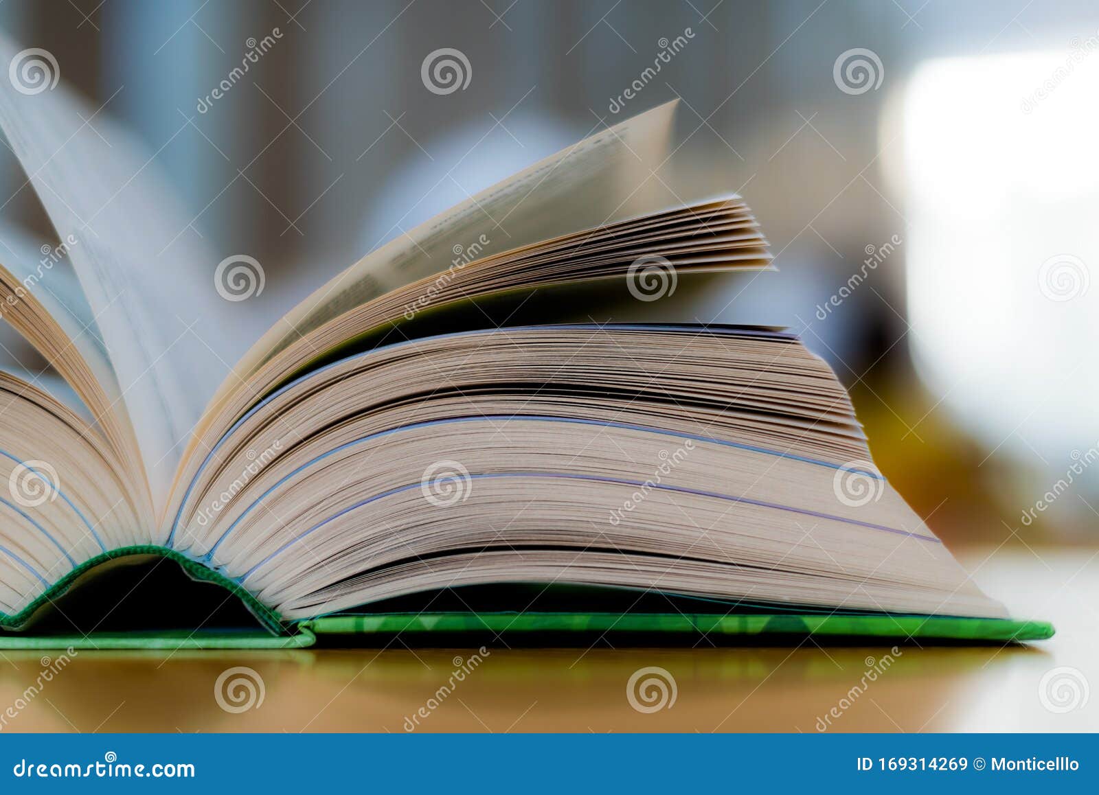 Open Book Lying on the Table in the Library Stock Image - Image of ...