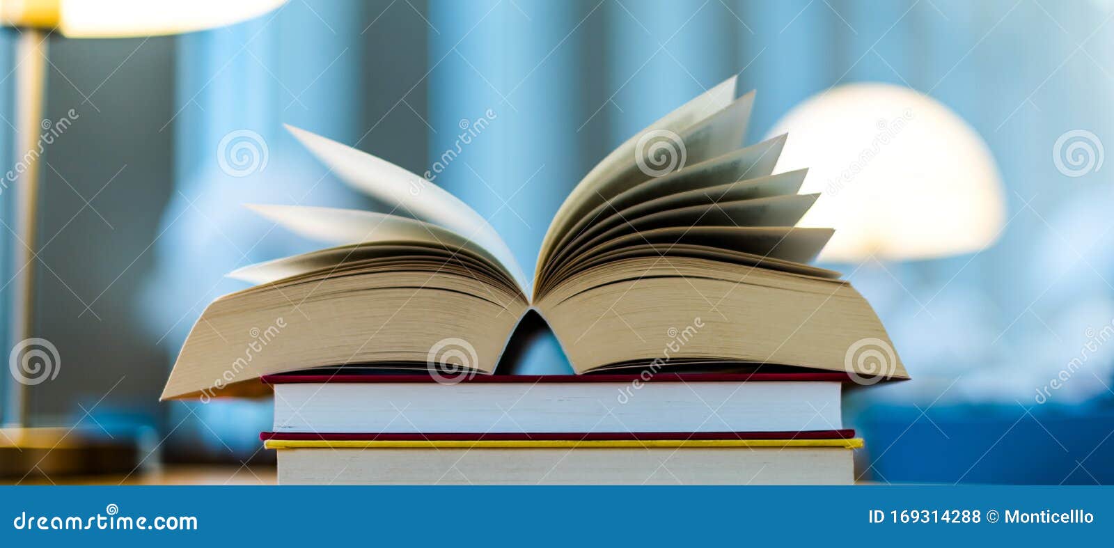 Open Book Lying on the Table in the Library Stock Photo - Image of ...