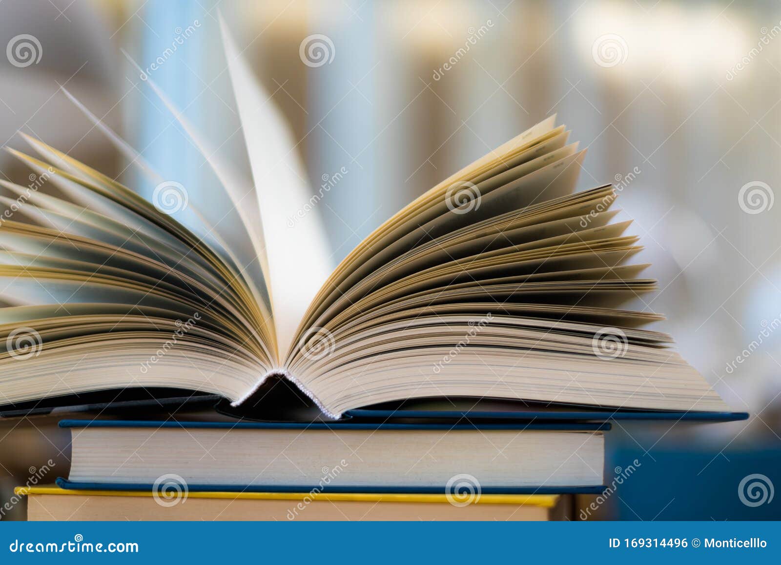 Open Book Lying on the Table in the Library Stock Photo - Image of ...