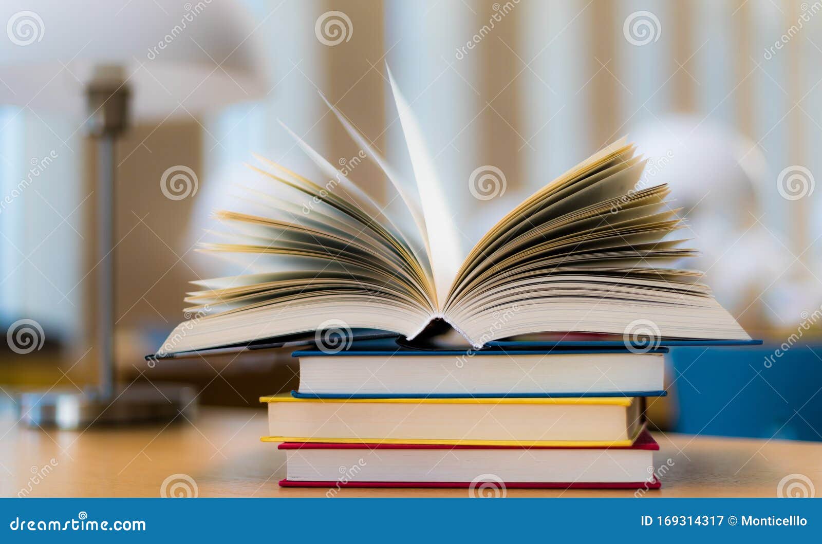 Open Book Lying on the Table in the Library Stock Image - Image of ...