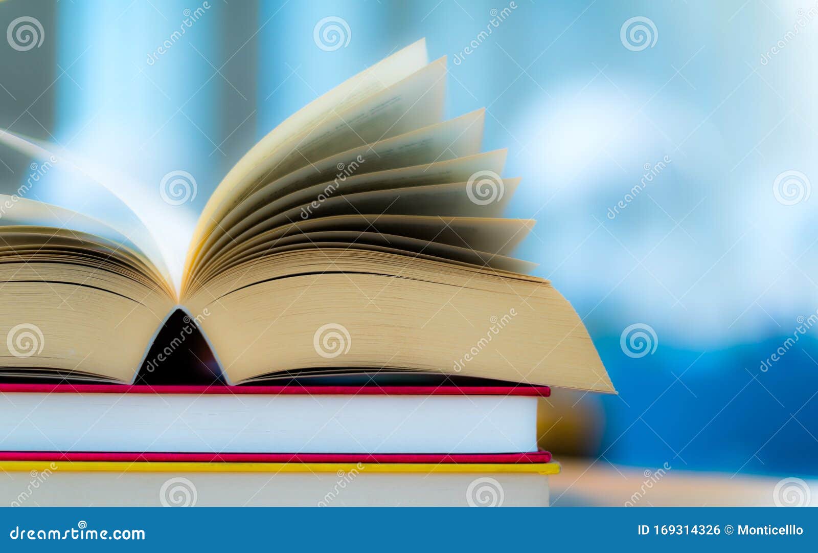 Open Book Lying on the Table in the Library Stock Photo - Image of ...