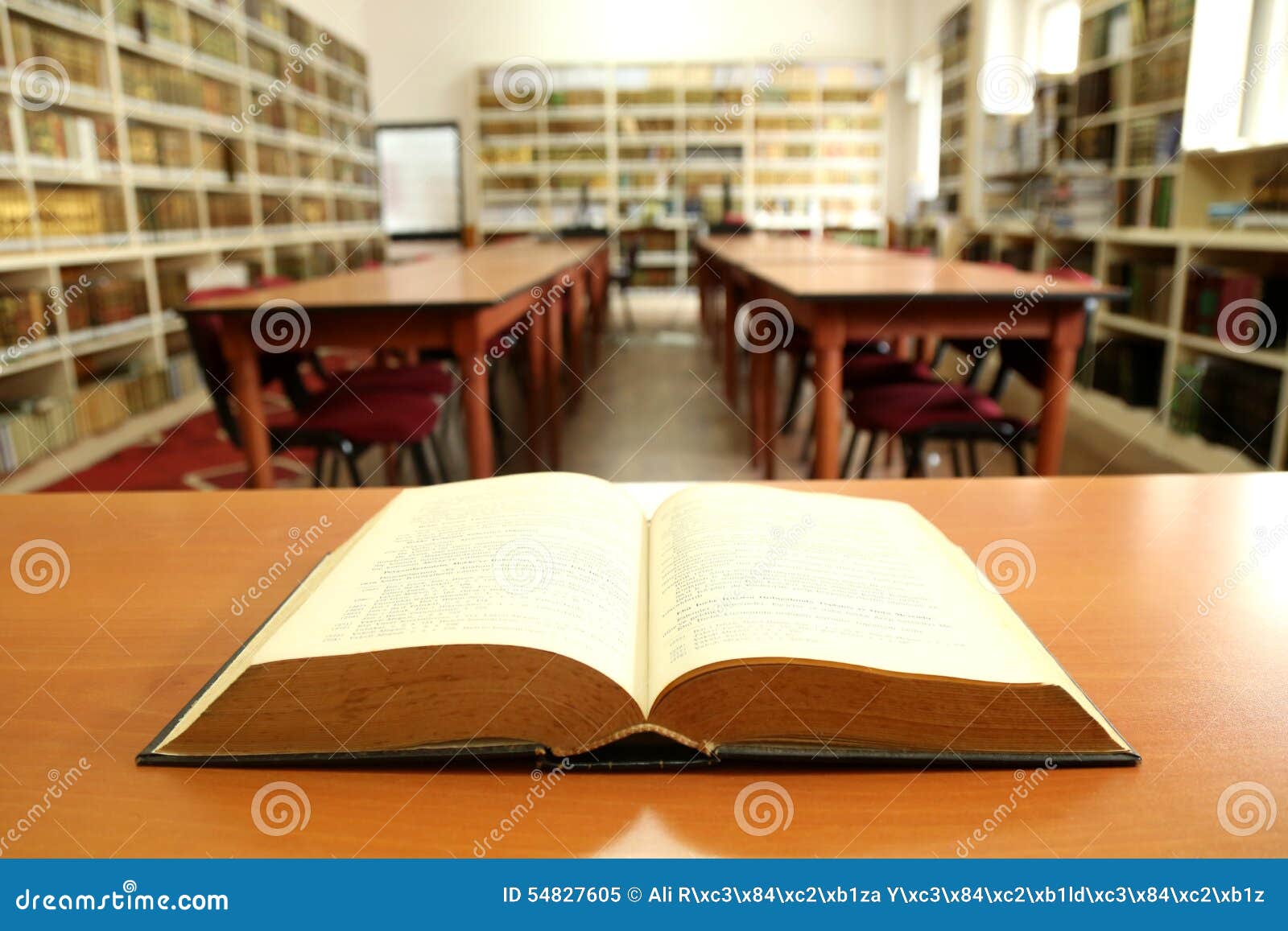 Open book in old library stock image. Image of books - 54827605