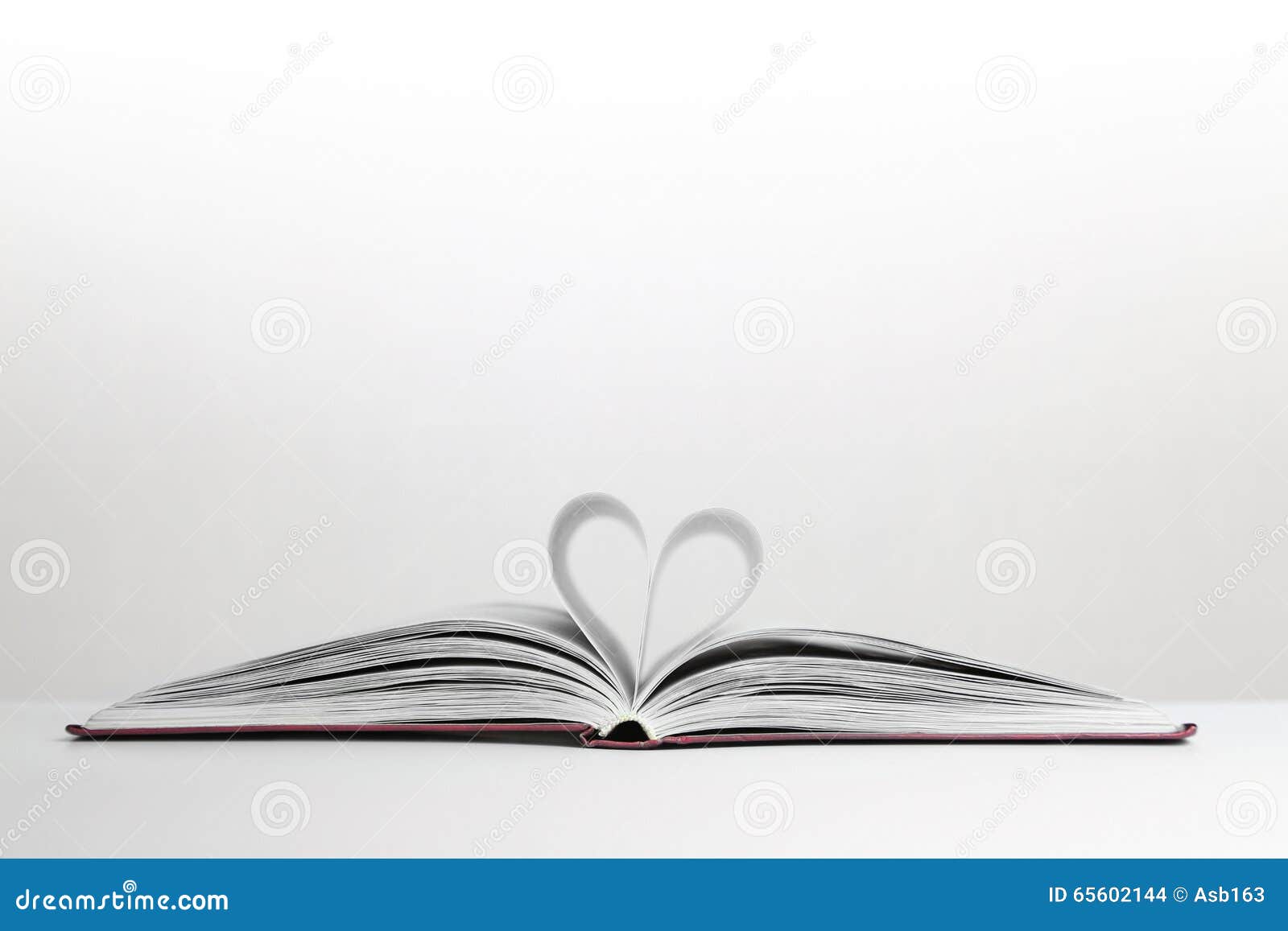 Open Book on with the Pages Folded into a Heart Stock Photo - Image of ...