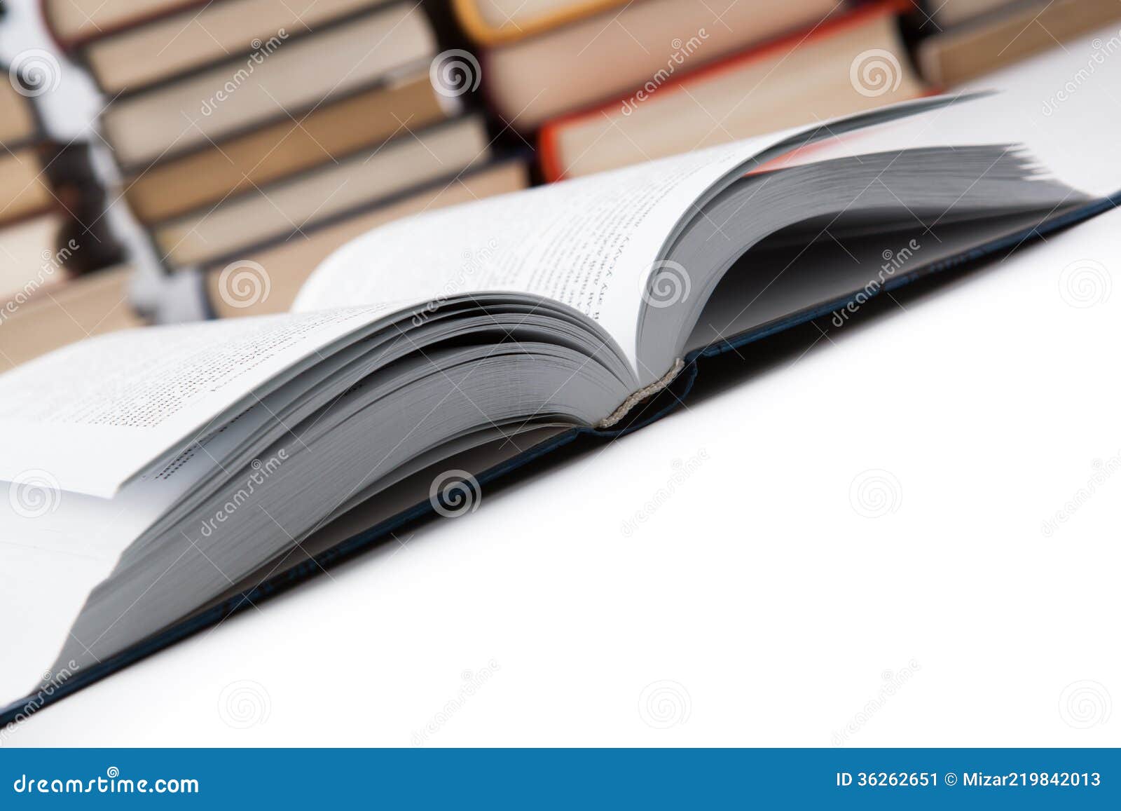 Open Book on with Pile of Books Stock Image - Image of white, bookmark ...