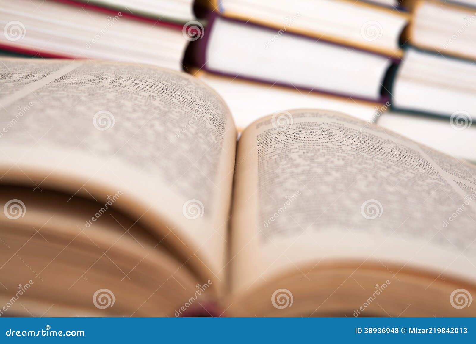 Open Book on with Pile of Books Stock Photo - Image of reading, series ...