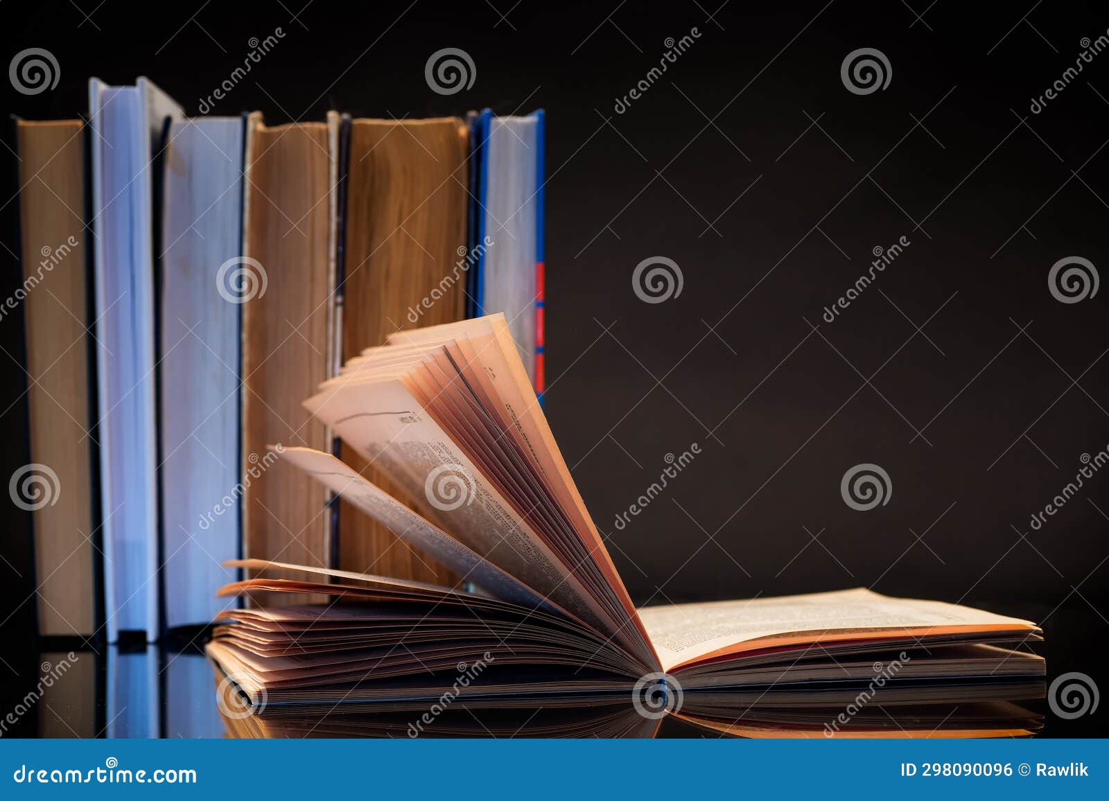 Open Book for Reading and a Stack of Books Stock Photo - Image of black ...