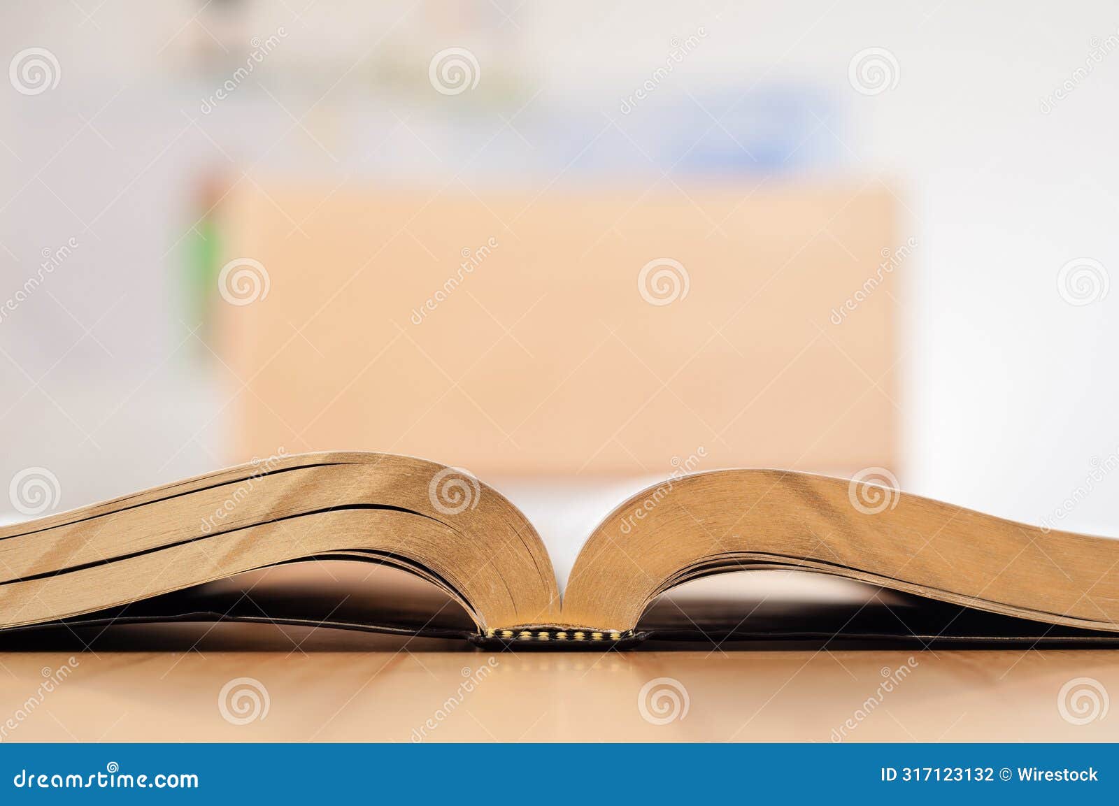 Open Book Resting on a Table Surface Stock Photo - Image of story ...