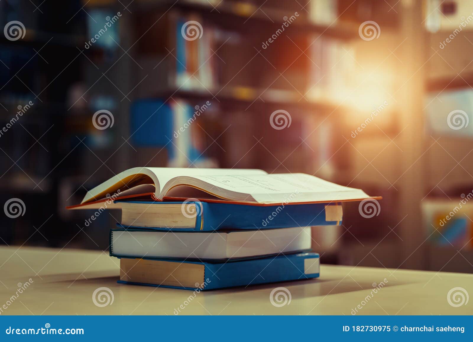 Open Book on Stack of Books in Library at School, University, College ...