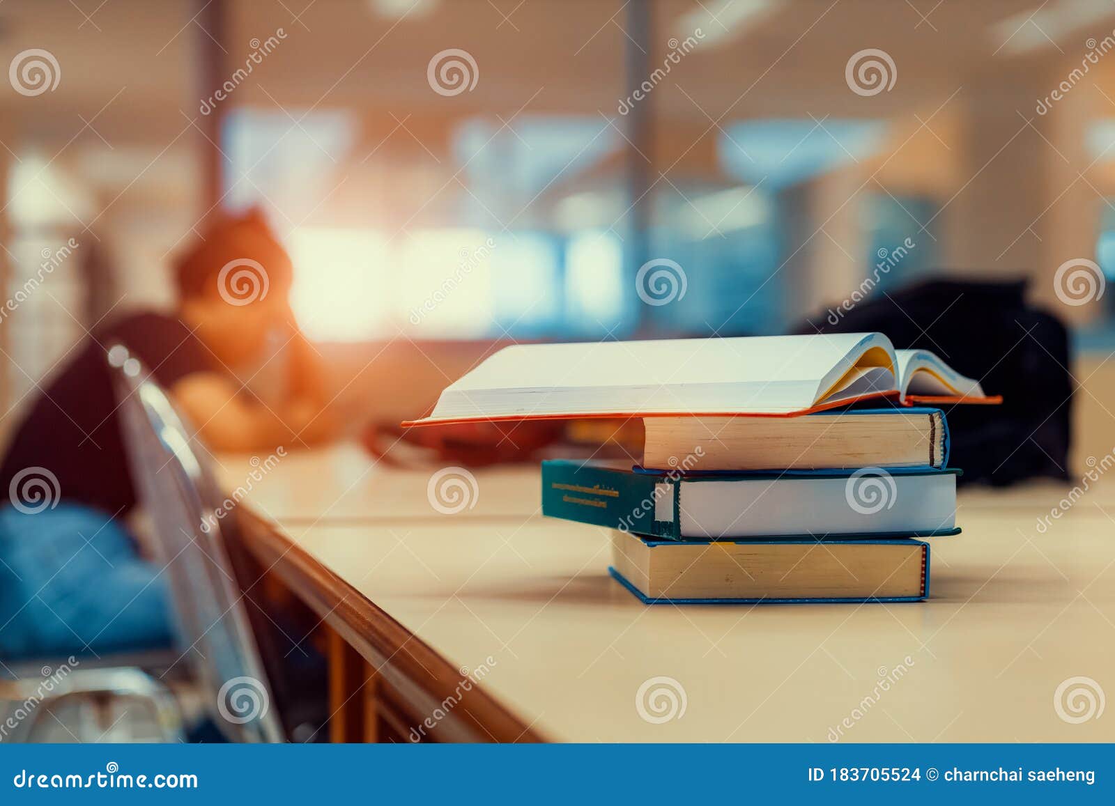 Open Book on Stack of Books in Library at School, University, College ...