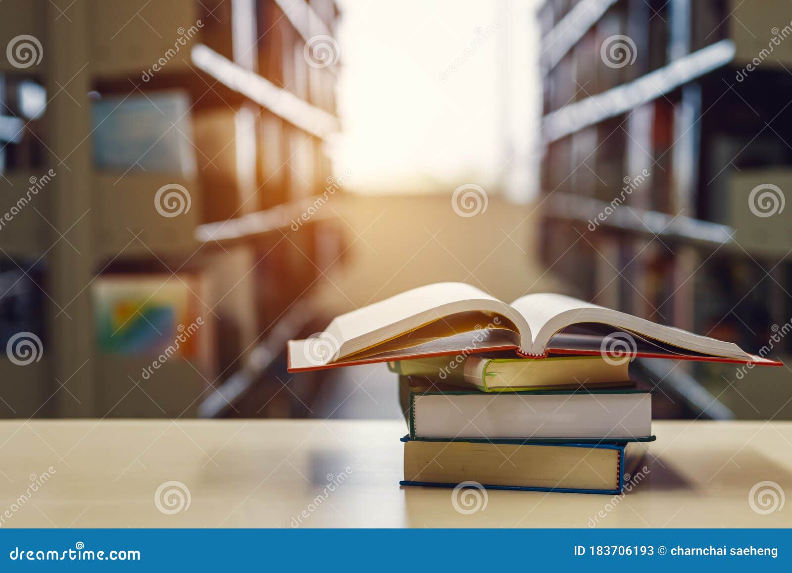 Open Book on Stack of Books in Library at School, University, College ...