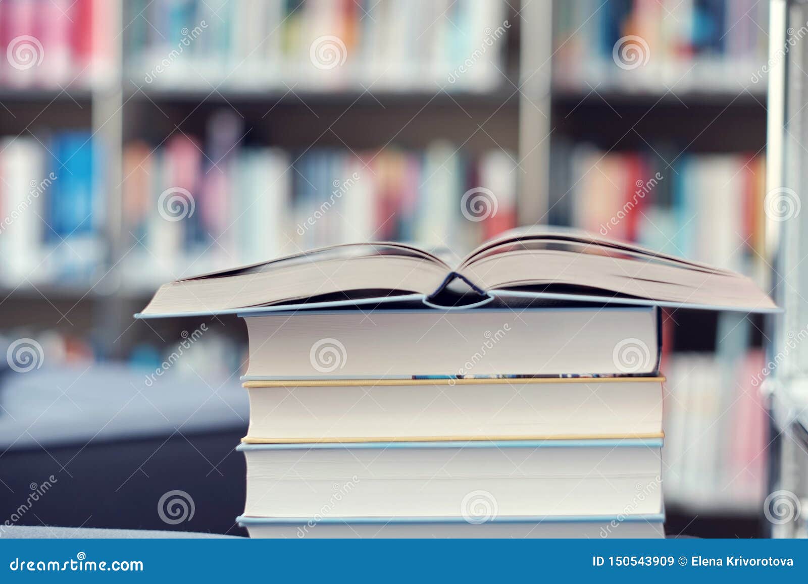 Open Book on a Stack of Books in a Library Stock Image - Image of ...