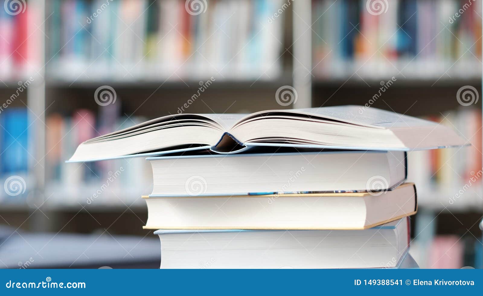 Open Book on a Stack of Books in a Library Stock Image - Image of ...