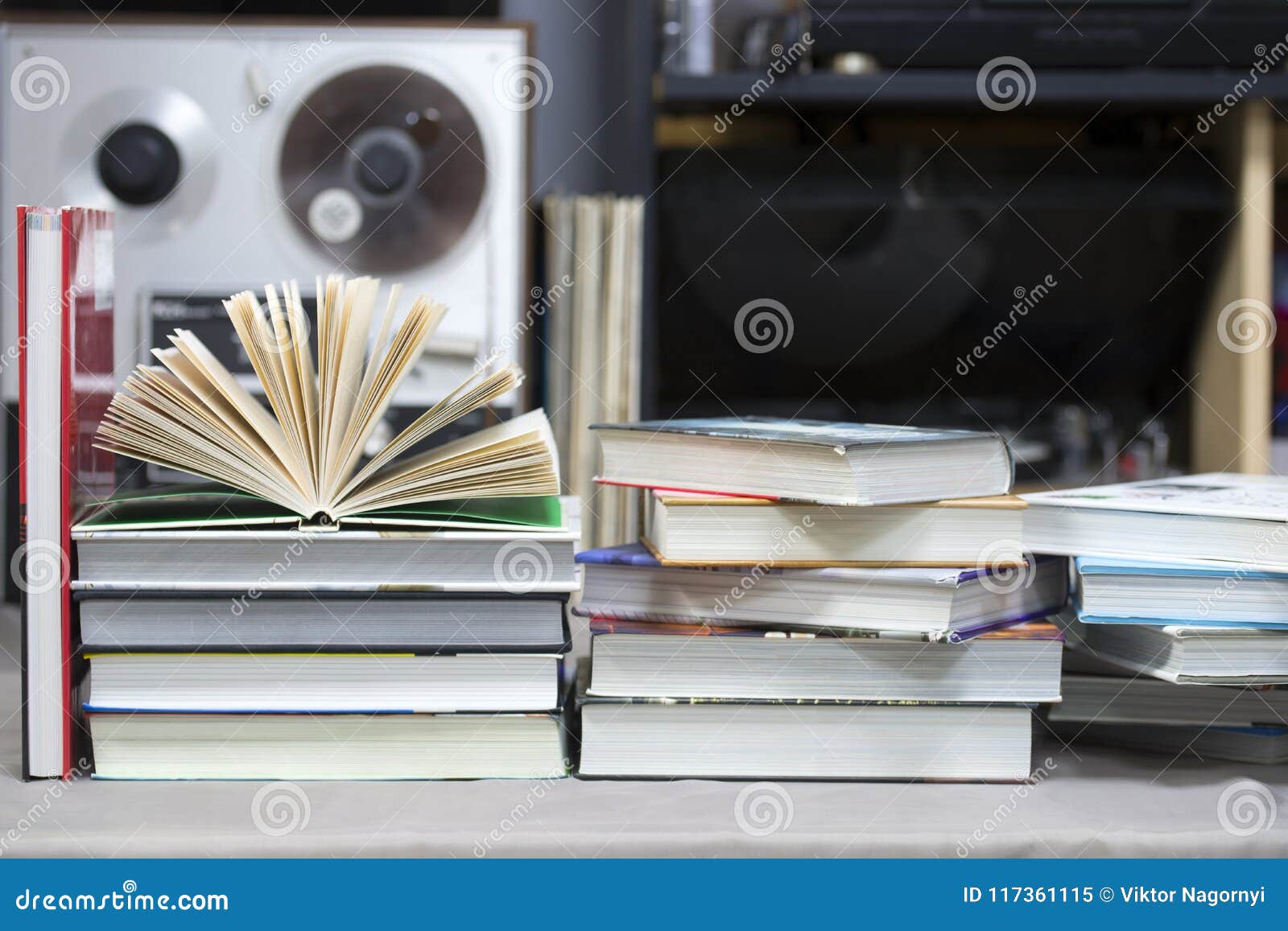Open Book, Stack of Hardback Books on Table. Top View. Stock Image ...