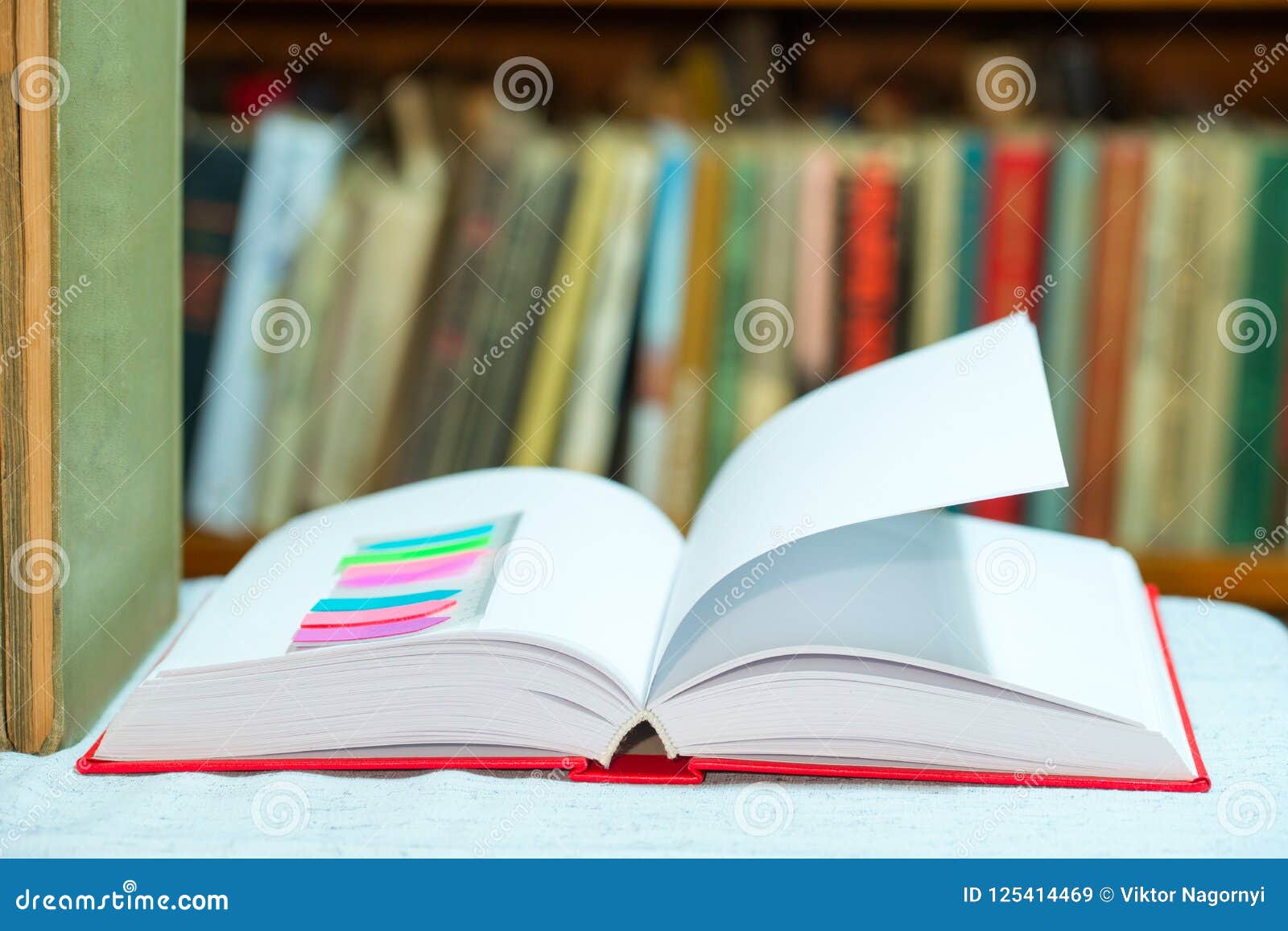 Open Book, Stack of Hardback Books on Table. Top View. Stock Image ...