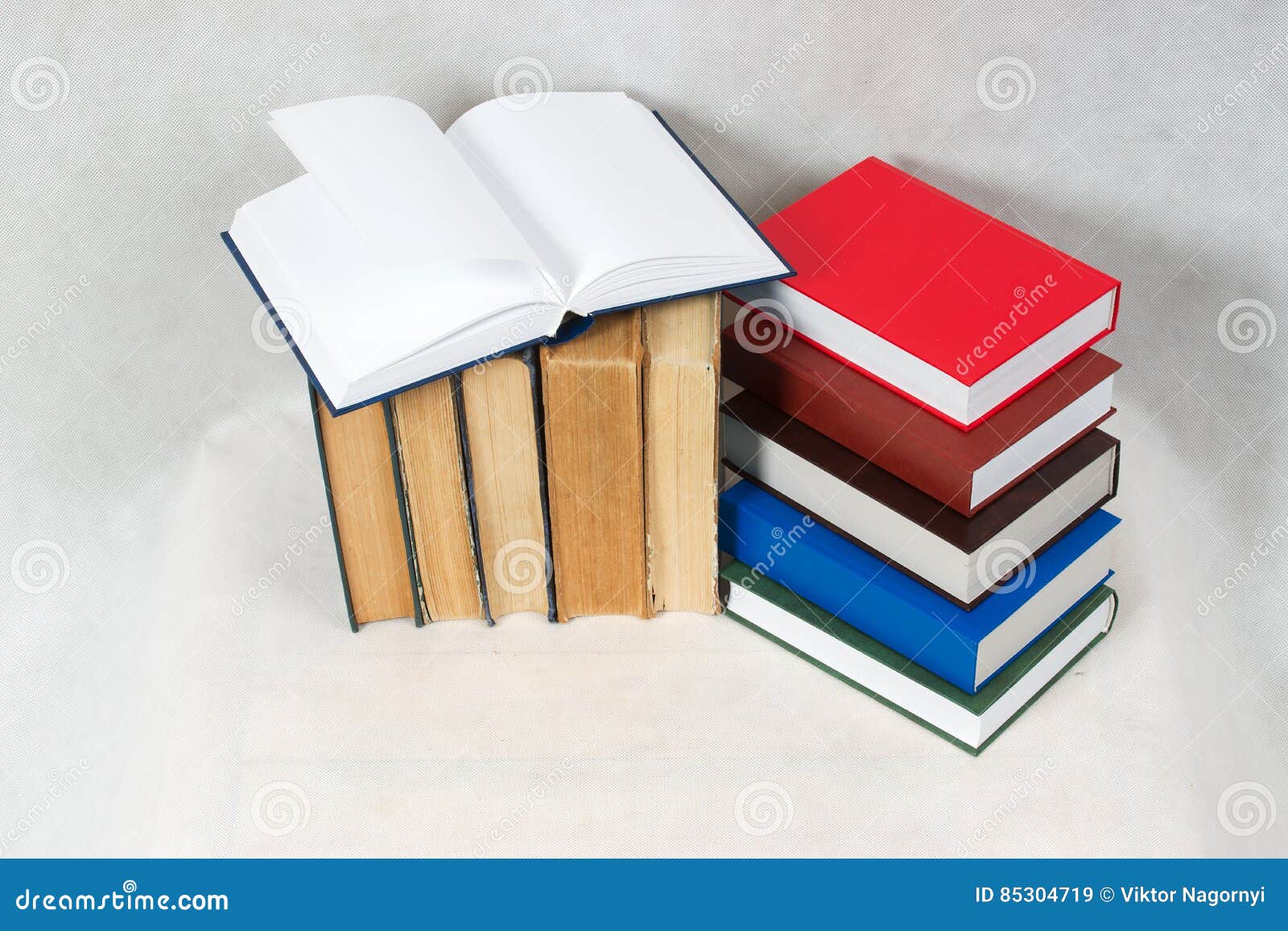 Open Book, Stack of Hardback Books on Table. Stock Image - Image of ...