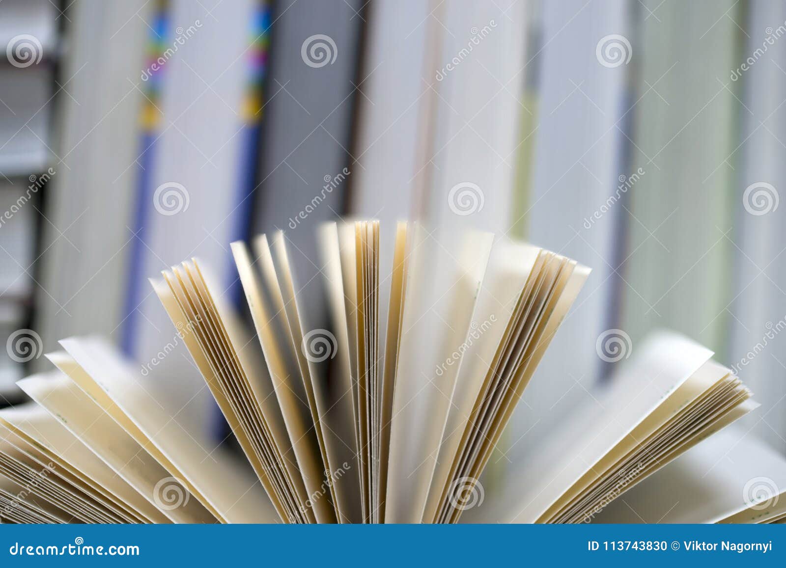 Open Book, Stack of Hardback Books on Table. Top View. Stock Photo ...