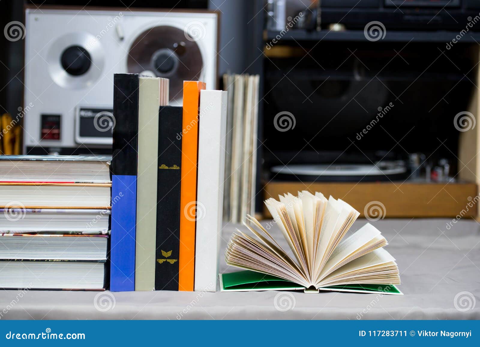 Open Book, Stack of Hardback Books on Table. Top View. Stock Image ...