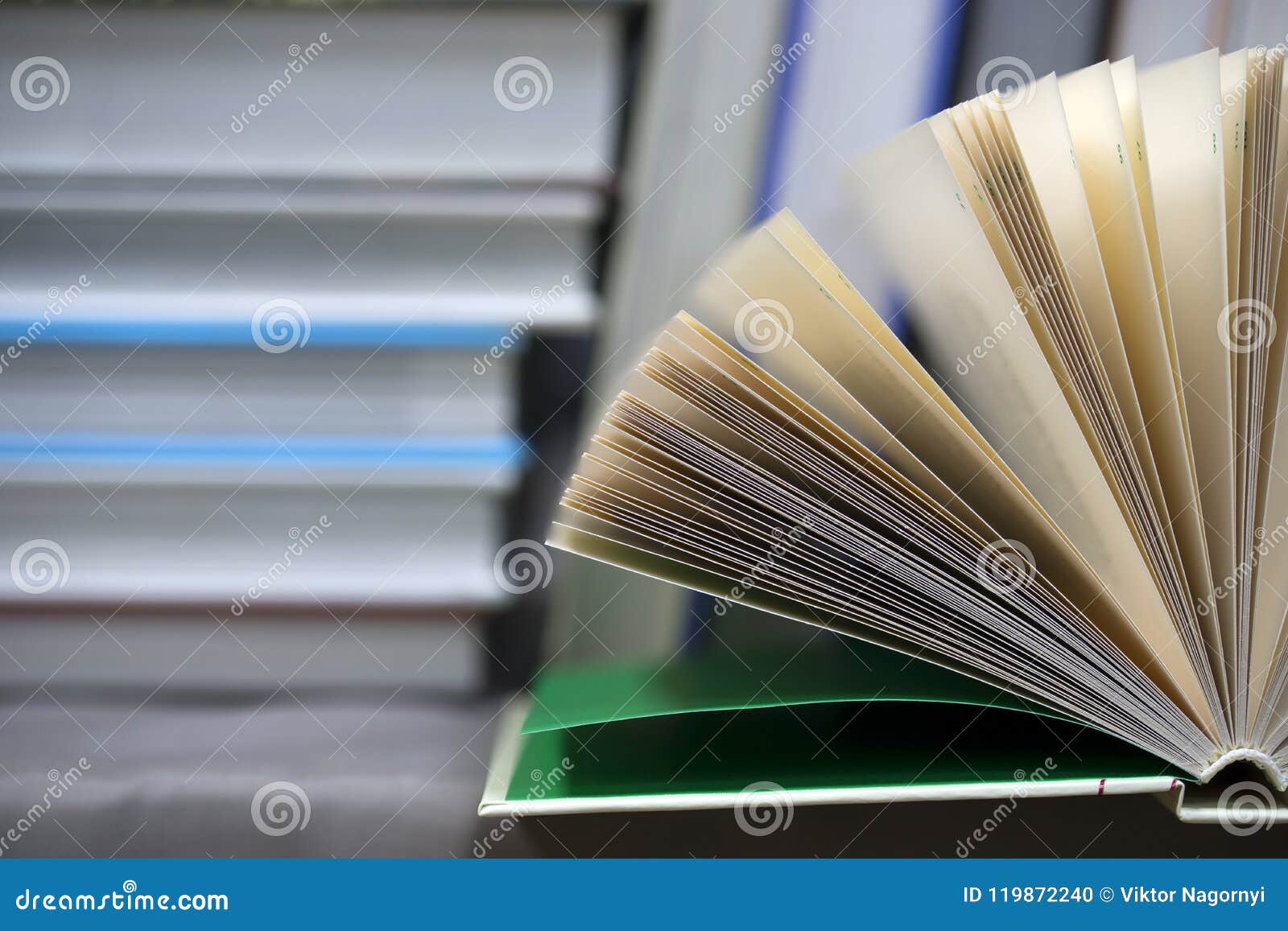 Open Book, Stack of Hardback Books on Table. Top View. Stock Photo ...